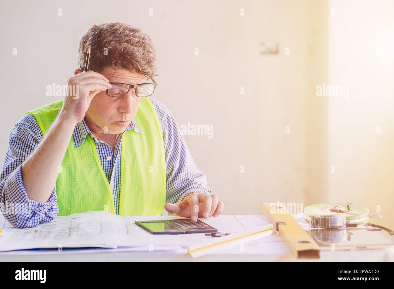 Engineer builder calculate construction bill cost feel worry for ...