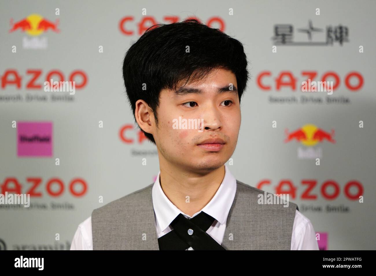 Si Jiahui speaks to the media after losing to Luca Brecel (not pictured) on day fifteen of the ...