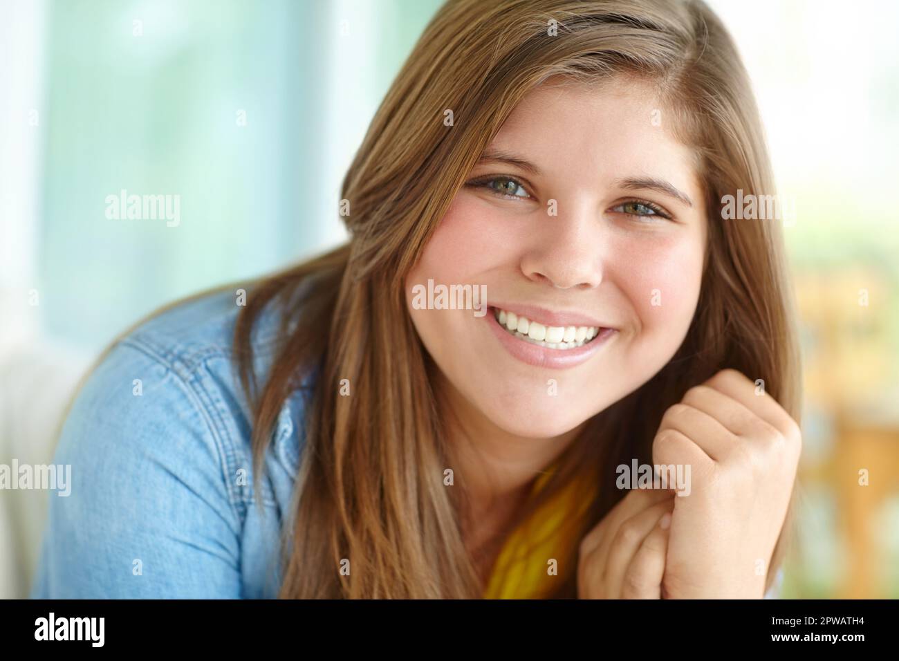That smile lights up a room. A pretty teenager smiling at you happily ...