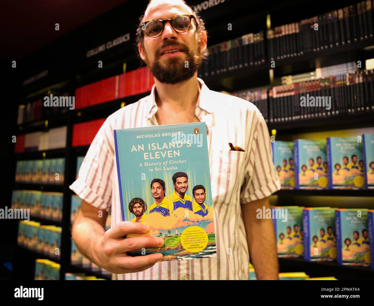 Author Nicholas Brooks with the novel 'An Island's Eleven: The Story of ...