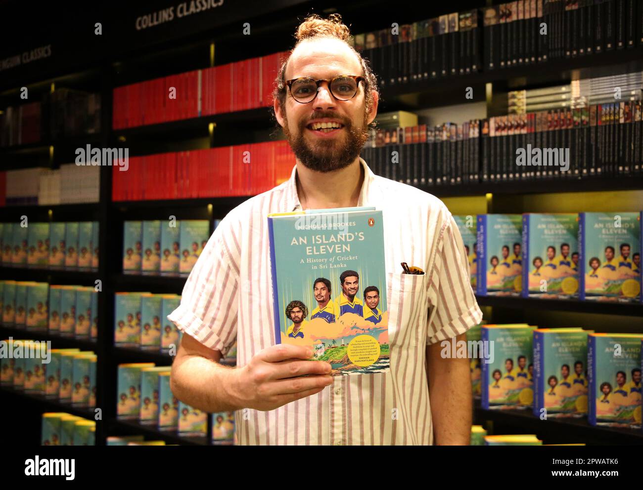 Author Nicholas Brooks with the novel 'An Island's Eleven: The Story of ...