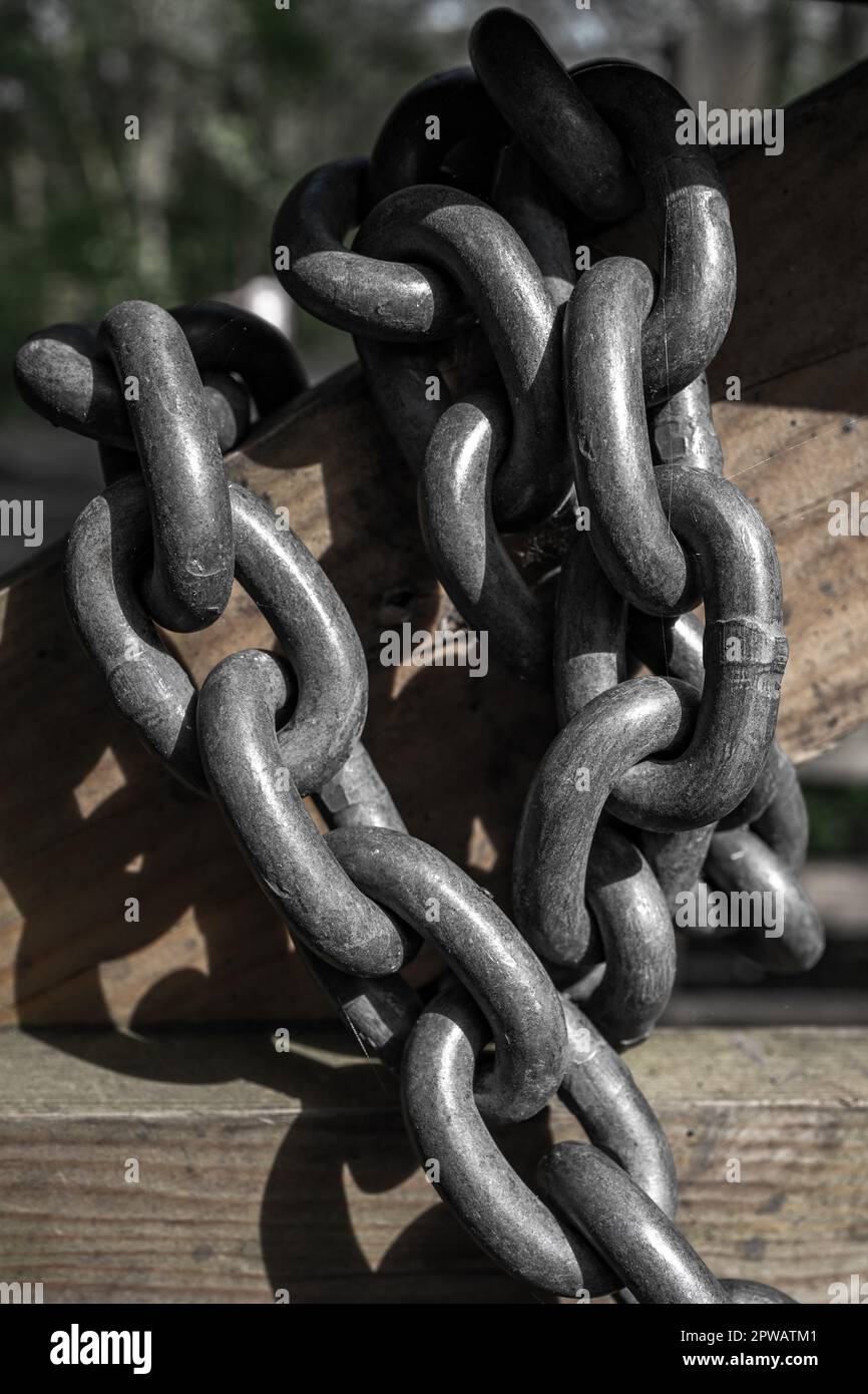Large metal chain wrapped around a wooden gate. Concept strength ...