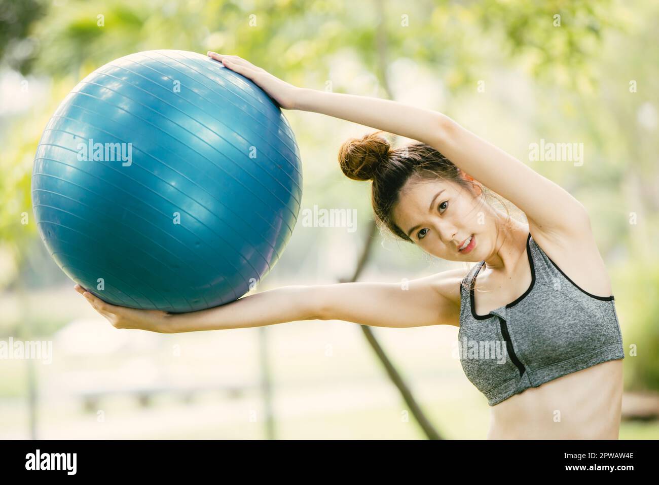 Beautiful Asian Happy Woman Play Enjoy Fun With Fit Ball Exercise At Park Outdoor Slim And