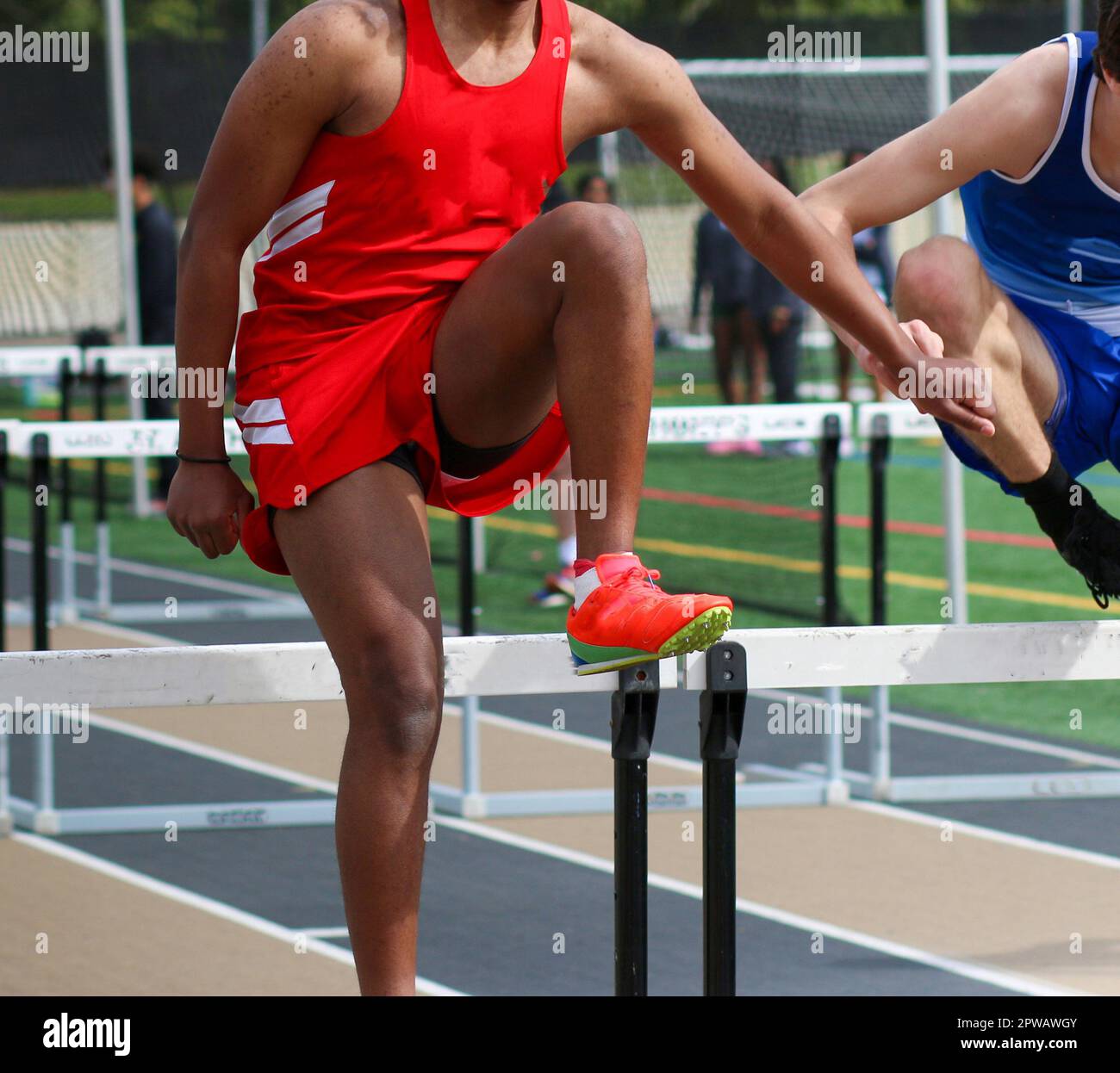 High school boys running hurdles hi-res stock photography and images ...
