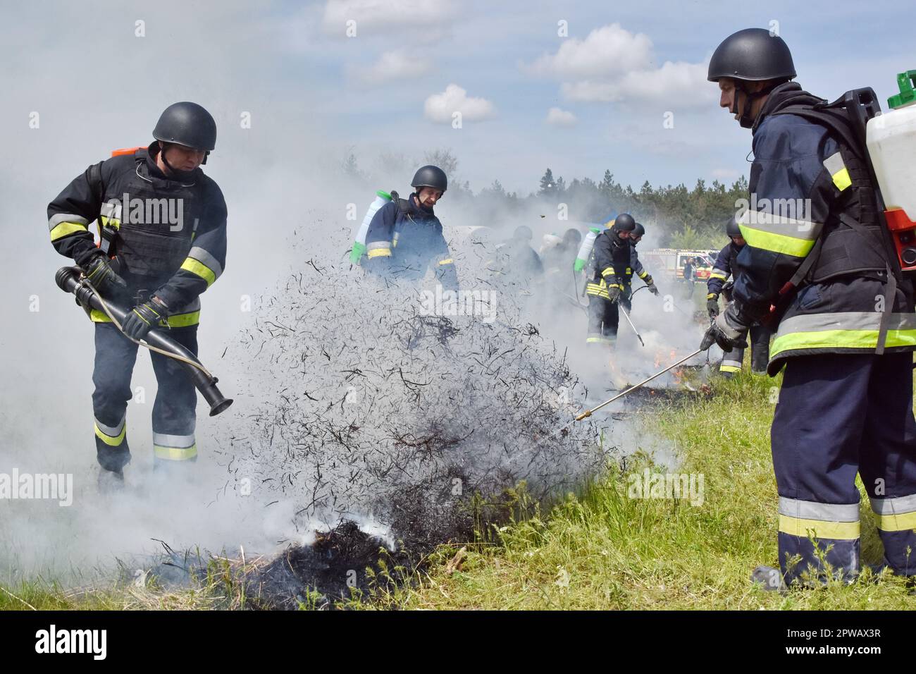Members of the Ukrainian State Emergency Service extinguish a fire ...