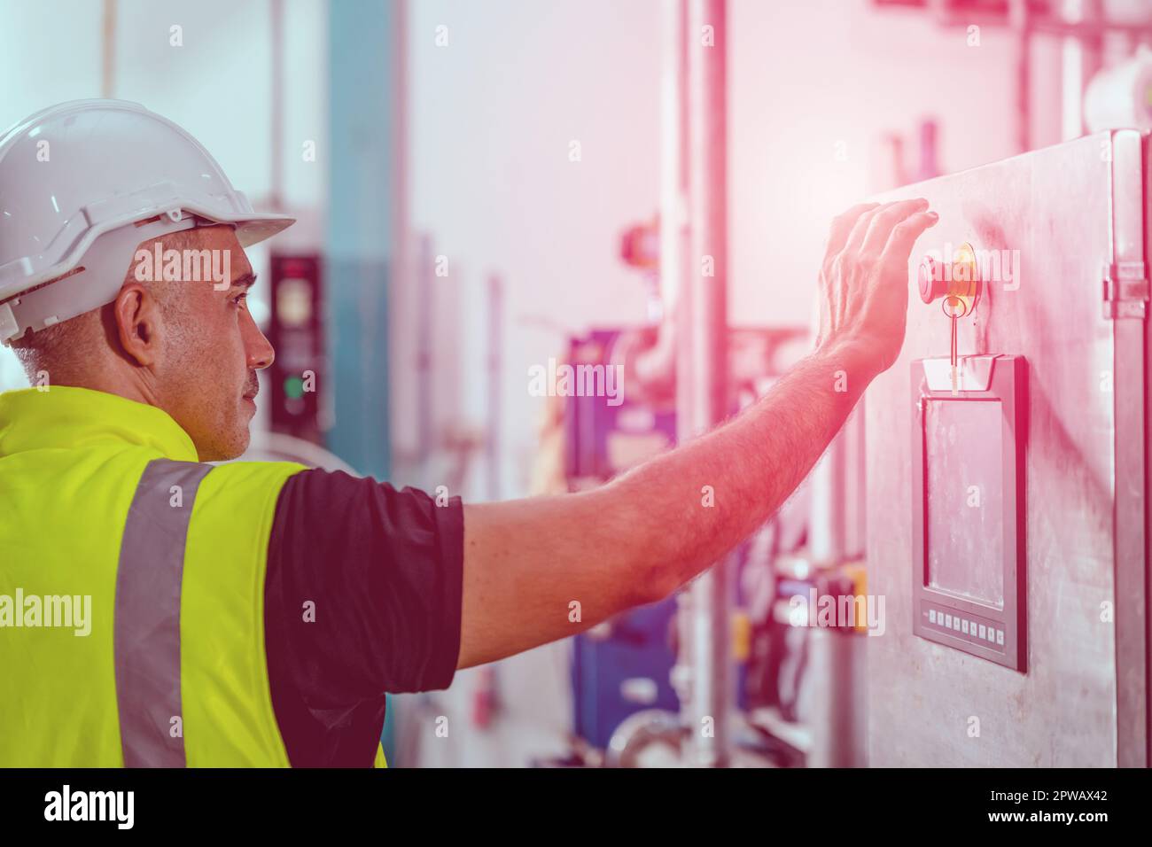 factory engineer staff pressing Emergency Stop Switch machine ...