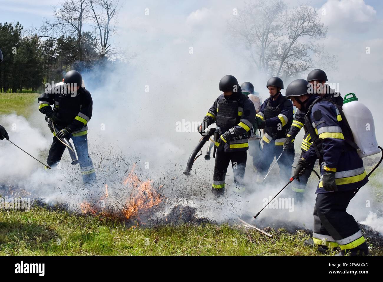 Members of the Ukrainian State Emergency Service extinguish a fire ...
