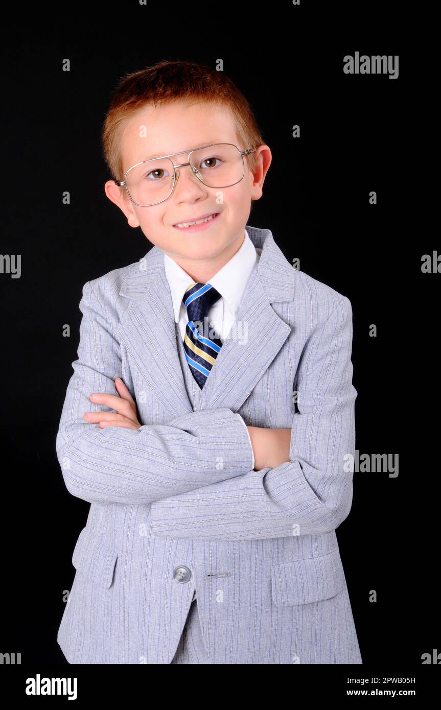 Young boy dressed formally wearing a suit Stock Photo - Alamy