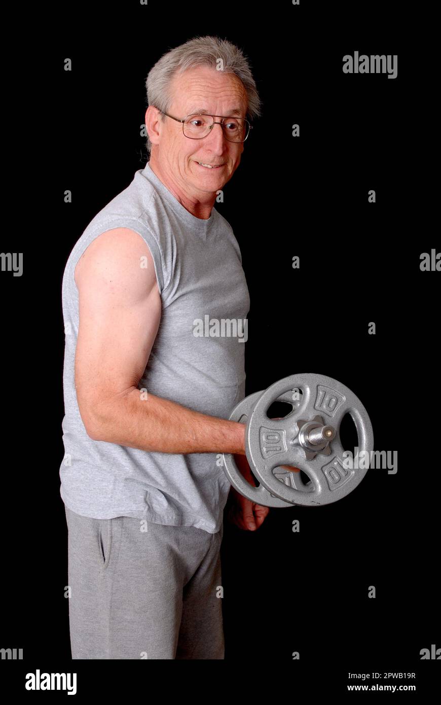 Senior citizen fitness training by lifting weights Stock Photo - Alamy