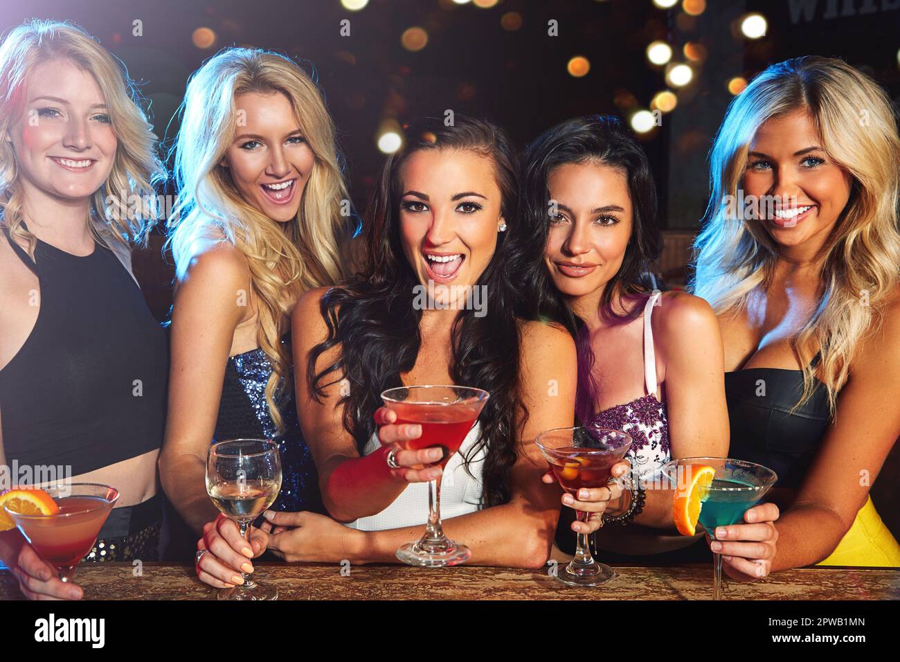 Lets party girls. young women partying in a nightclub Stock Photo - Alamy