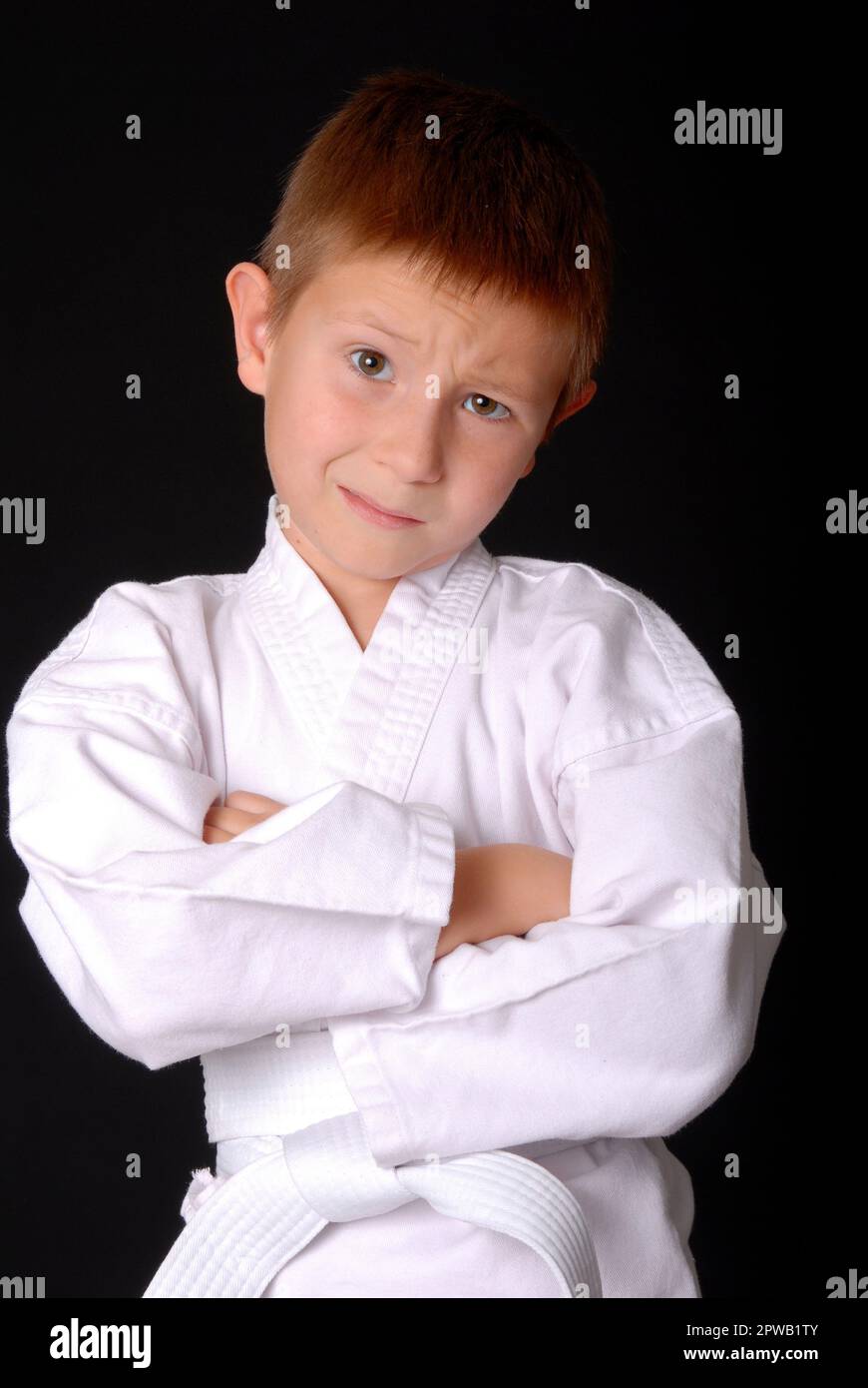 Young boy in karate outfit with attitude Stock Photo - Alamy