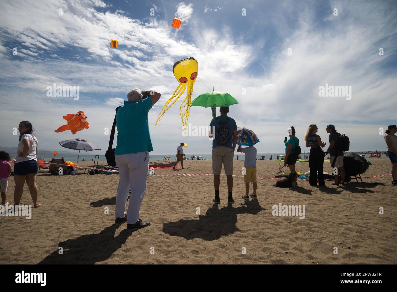 Malaga, Spain. 29th Apr, 2023. People are seen watching kites floating ...