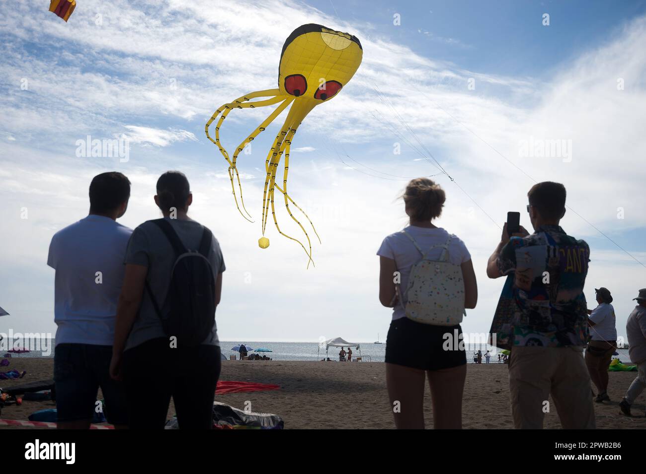 Malaga, Spain. 29th Apr, 2023. People are seen watching a kite ...