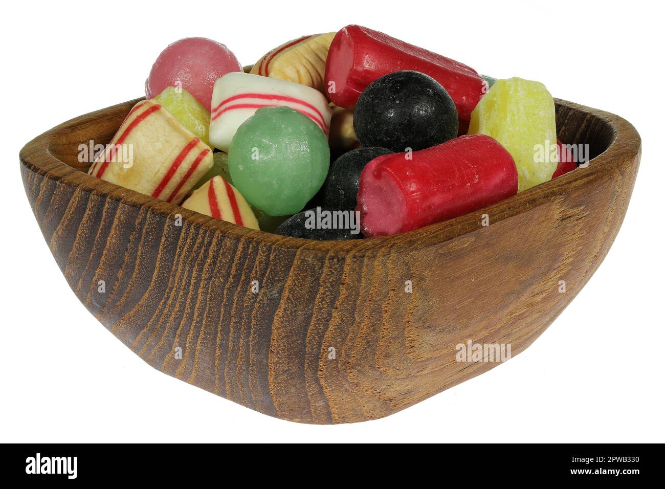 classic Dutch candies in a wooden bowl isolated on white background ...