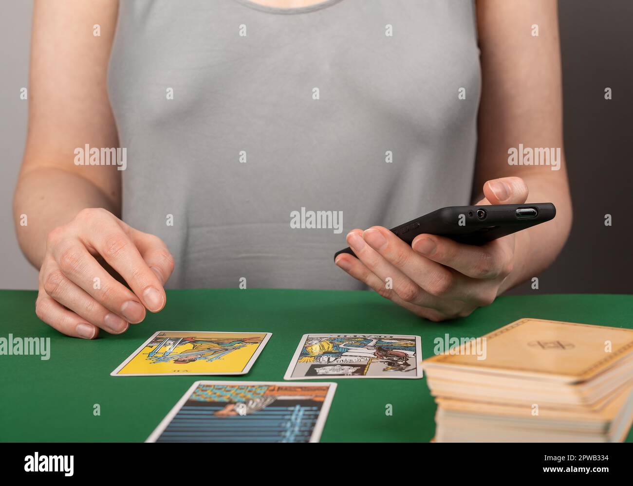 Lodz, Poland March 31 2023 Tarot card reading with mobile phone app ...