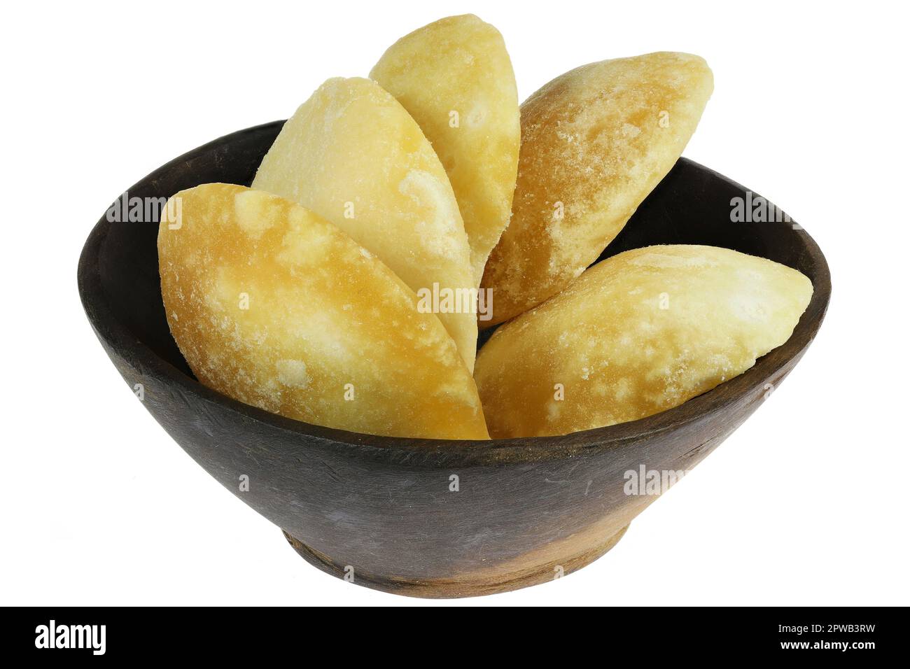 palm sugar chunks in a wooden bowl isolated on white background Stock ...