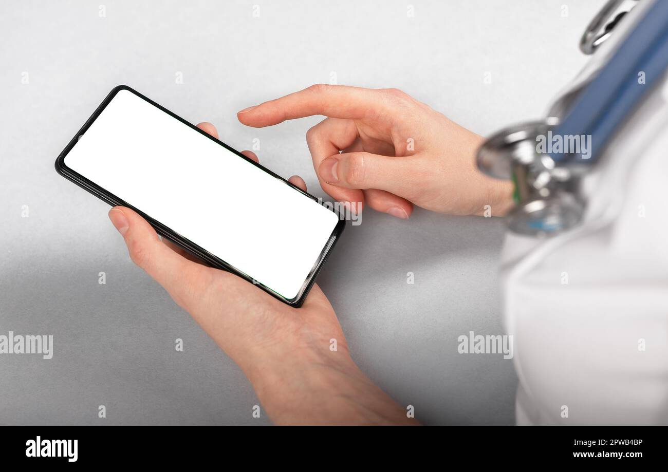 Doctor hand using medical phone screen mockup closeup Stock Photo - Alamy