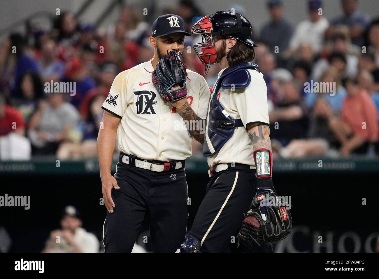 Texas Rangers relief pitcher Jonathan Hernandez (72) talks to catcher ...