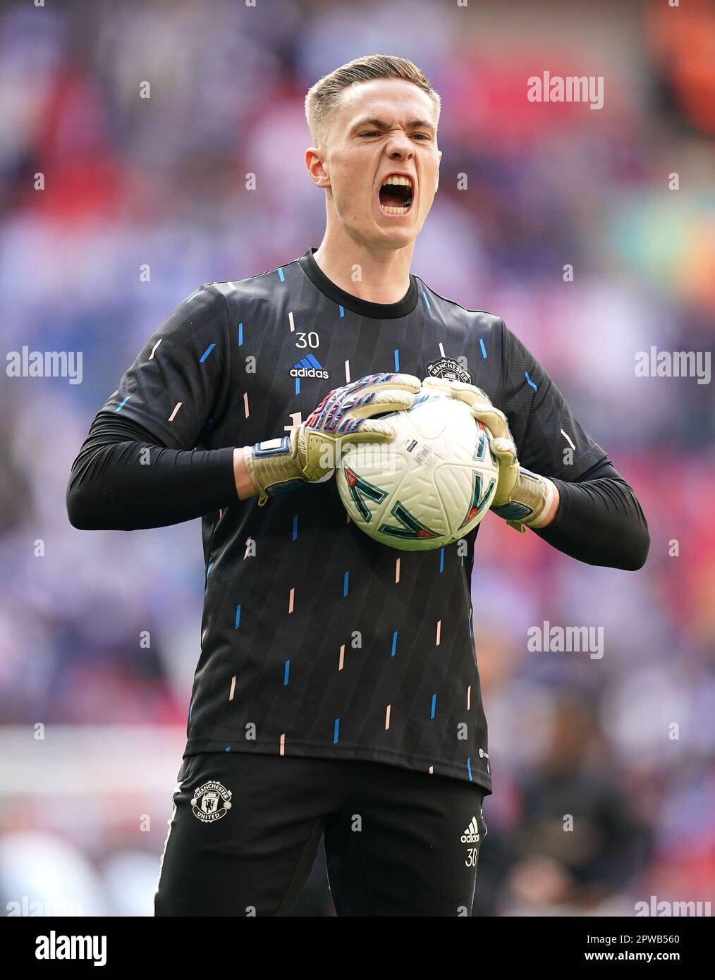 Manchester United goalkeeper Nathan Bishop warming up before the ...