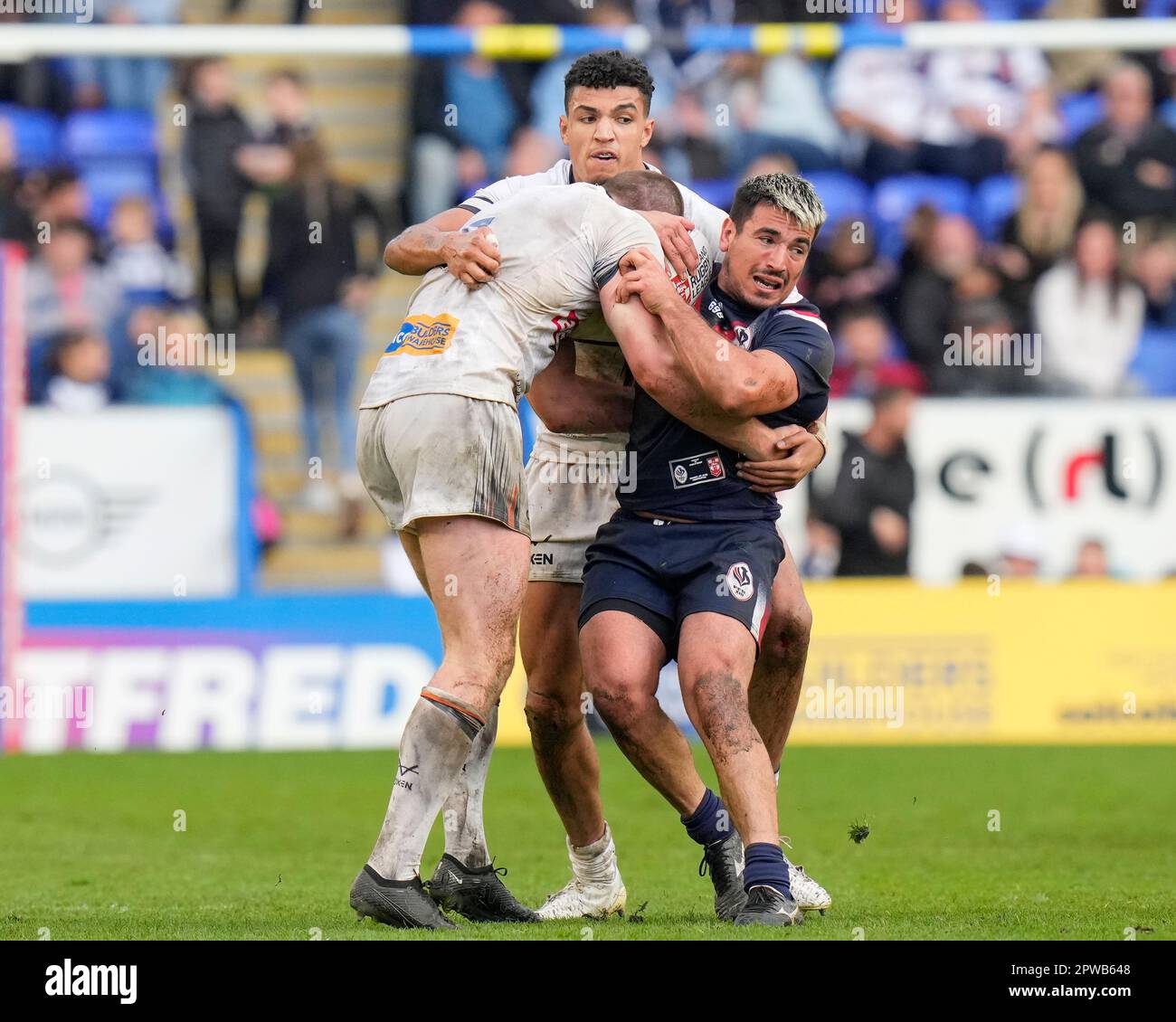 James Harrison #15 of England and Kai Pearce-Paul #12 of England tackle ...