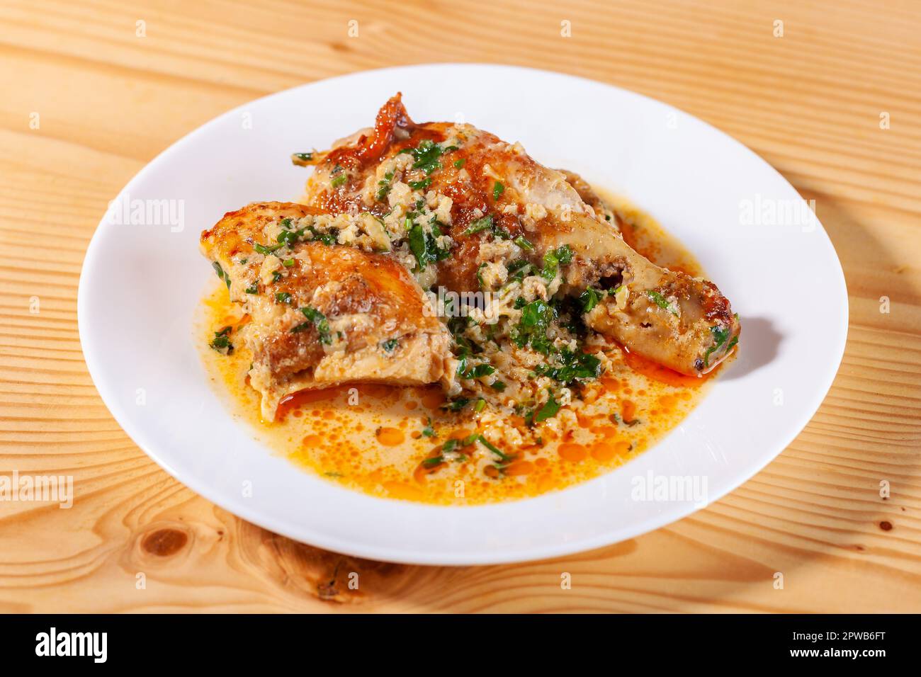 Shkmeruli is a traditional Georgian dish of chicken in garlic sauce in ...