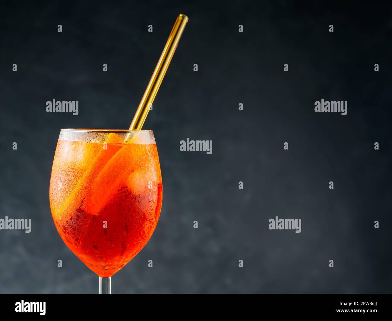 Glass of Aperol Spritz cocktail on a dark background. Cocktail Aperol ...