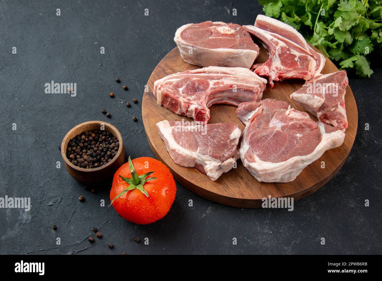 front view fresh meat slices raw meat with fork and knife on dark ...