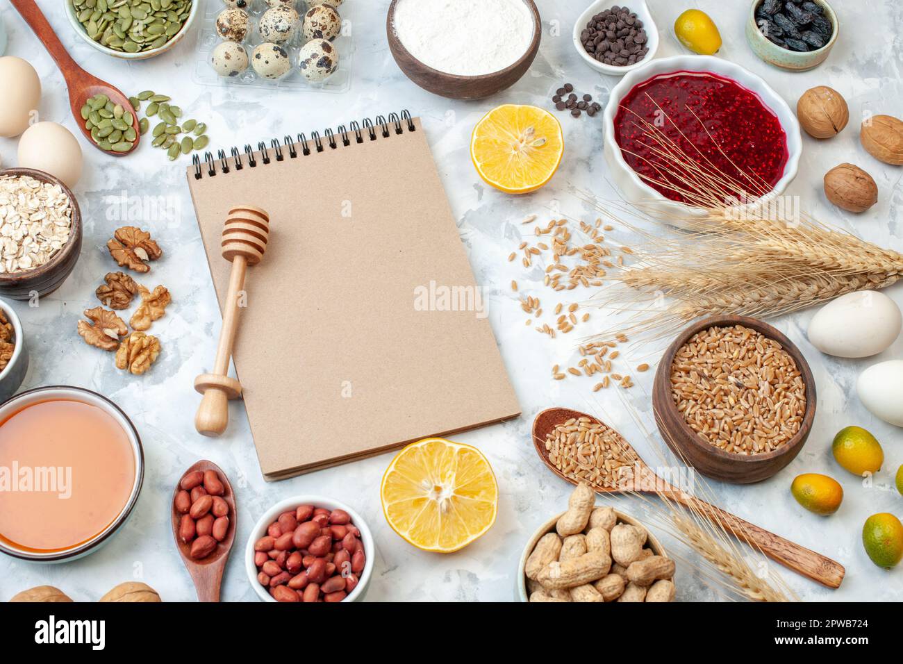 front view simple notepad with eggs flour jelly different nuts and ...