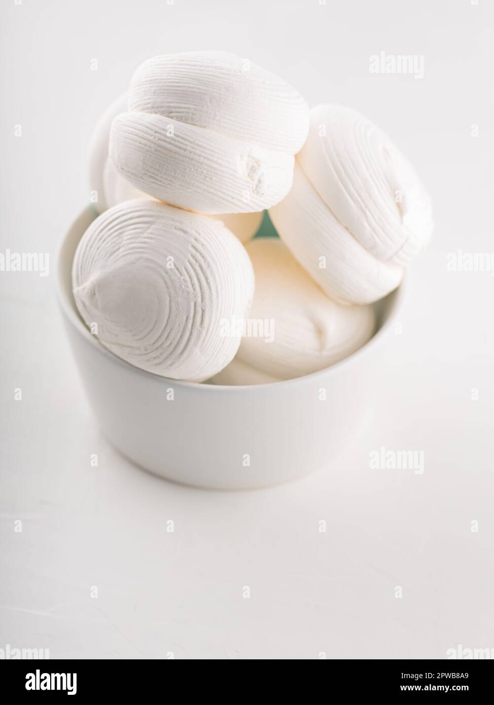 Sweet dessert white zephyr marshmallows in a bowl. Delicious zephyr ...