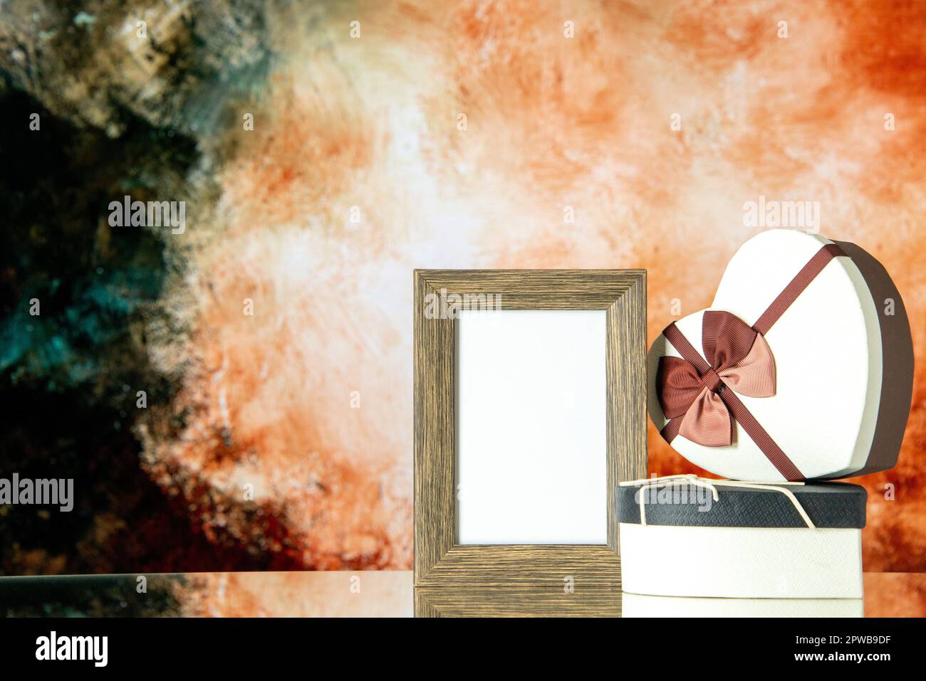 front view valentines day presents with picture frame on a light brown ...