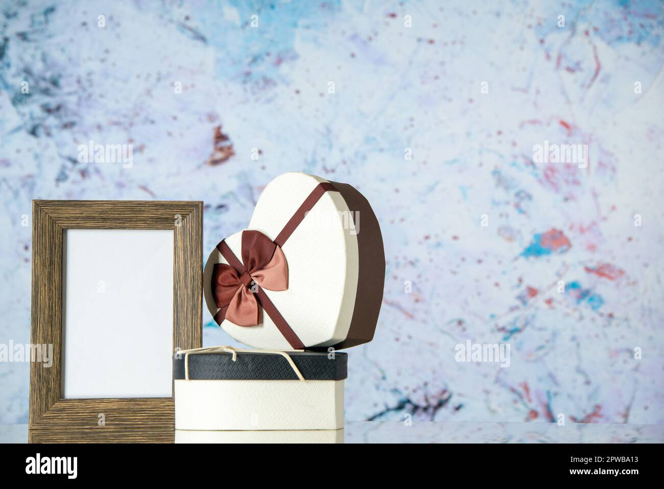 front view valentines day presents with picture frame on light ...