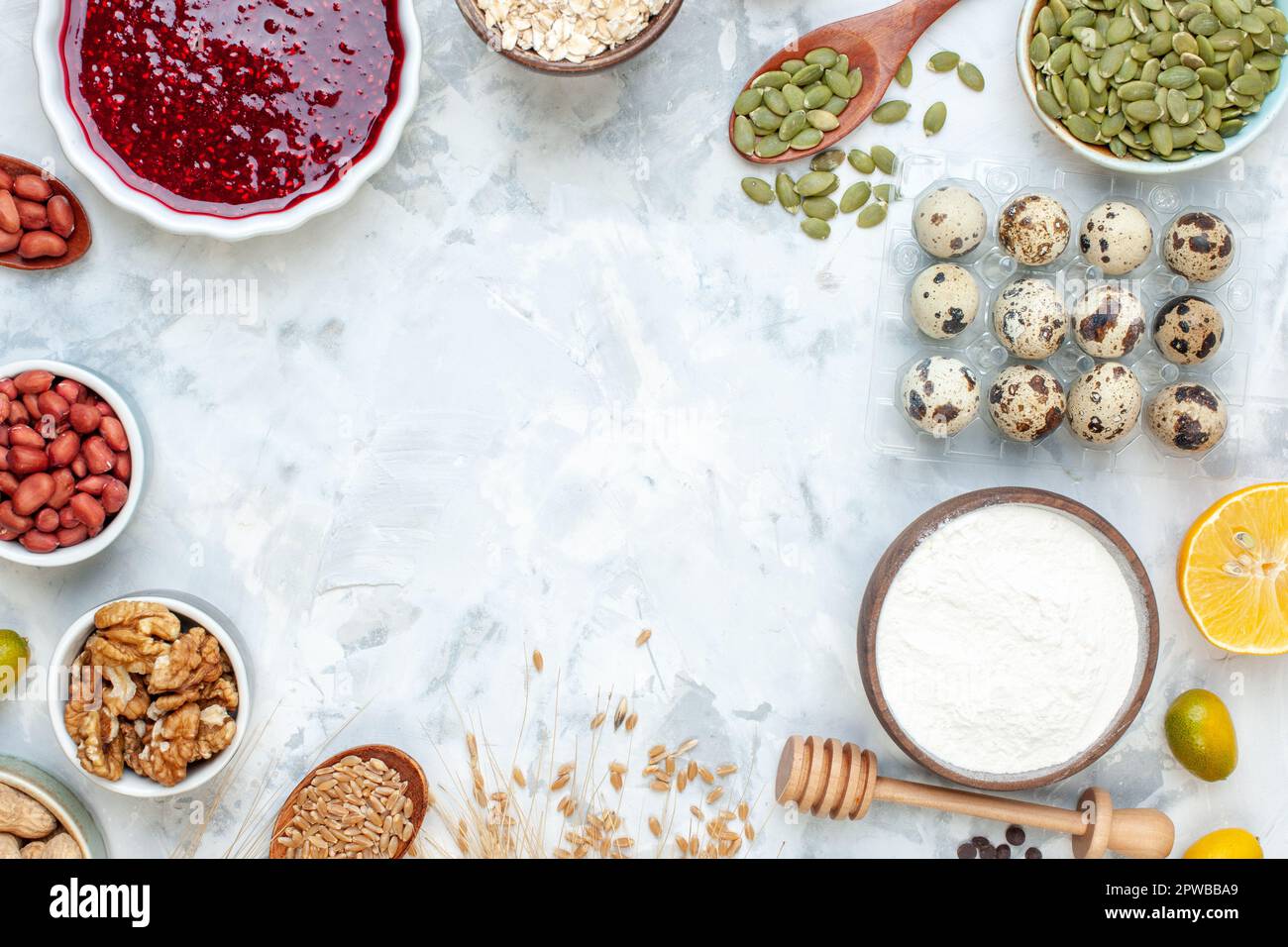 top view different pie ingredients jelly eggs nuts seeds and flour on ...