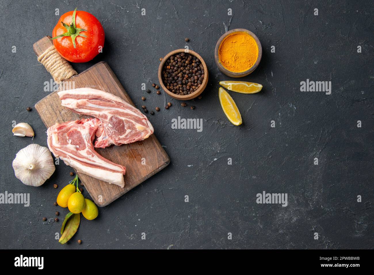 top view fresh meat slice raw meat with seasonings on dark background ...