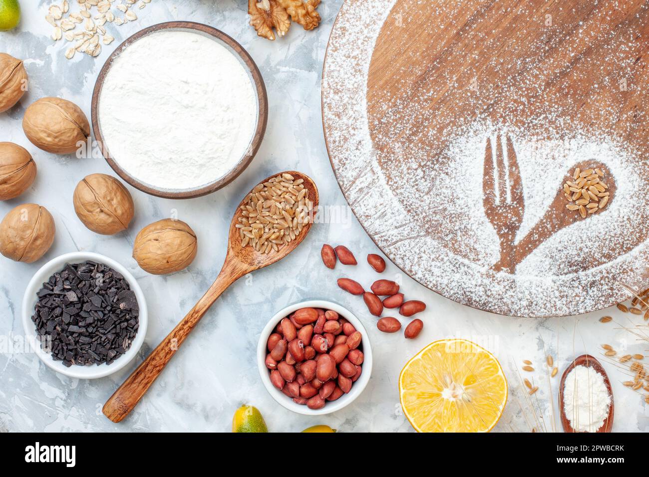 top view round desk with flour jelly eggs and different nuts on white ...