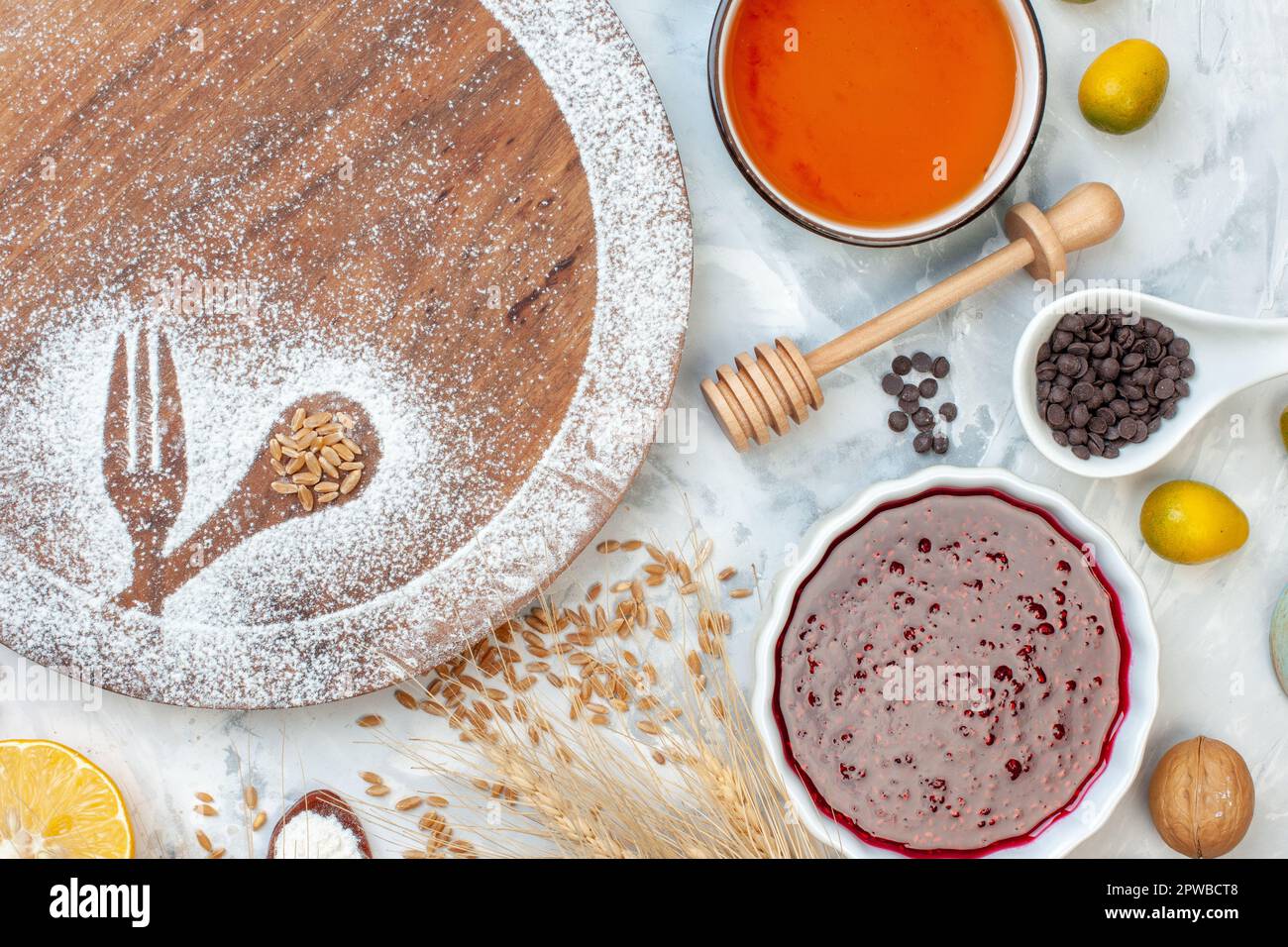 top view round desk with flour jelly eggs and different nuts on a white ...