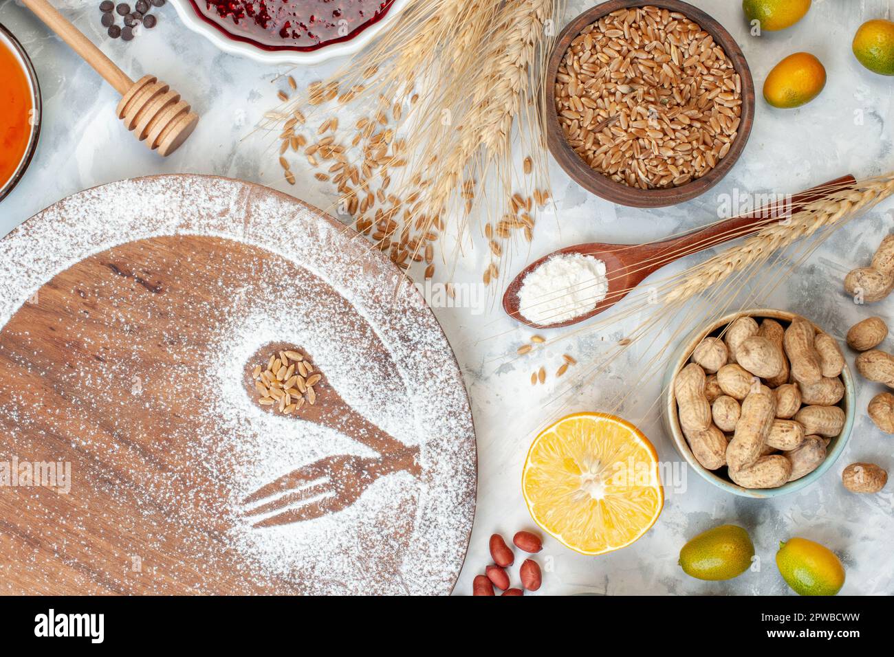 top view round desk with flour jelly eggs and different nuts on white ...
