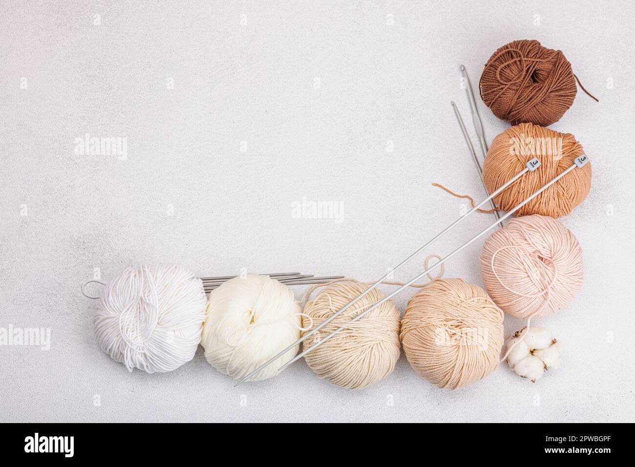 A set of pastel natural colors clews of thread for knitting and special ...