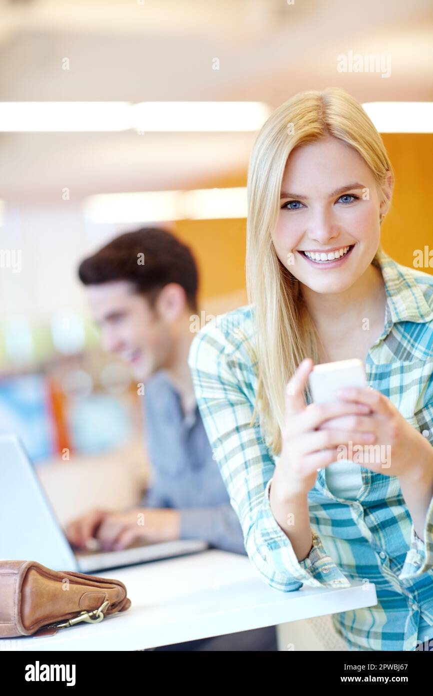 Your typical teenage girl. Attractive female student reading a text ...