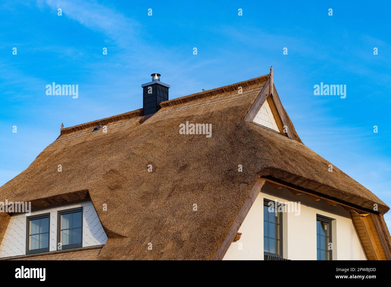 Re-thatching of thatched roofs in Drankse, Baltic Sea, Island of Rügen ...