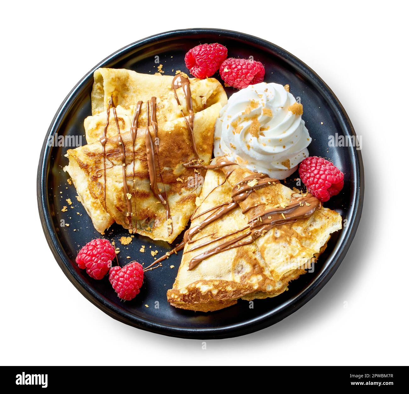 plate of freshly baked crepes with whipped cream and raspberries ...