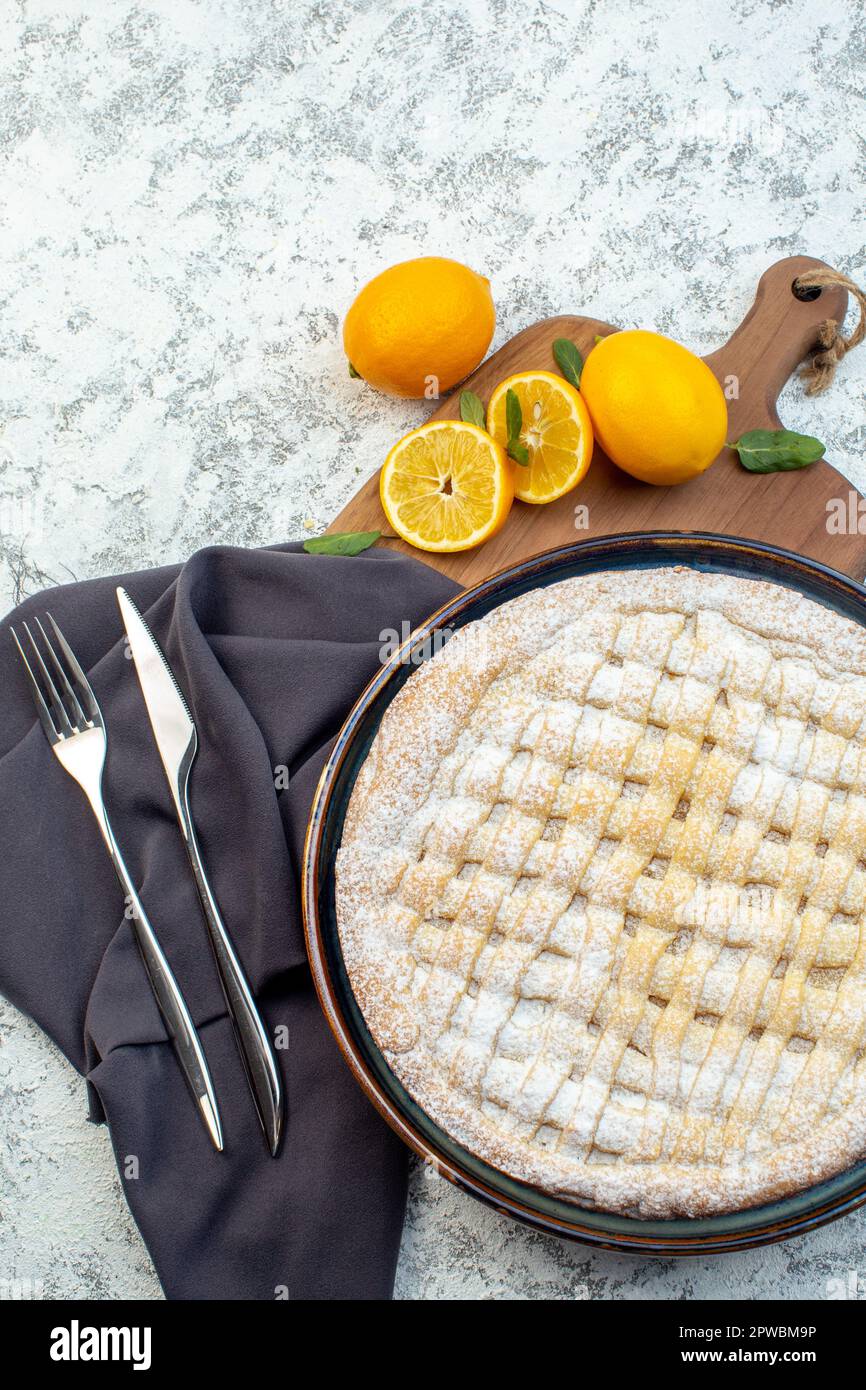 top view yummy lemon pie sugar powdered inside pan on white background ...