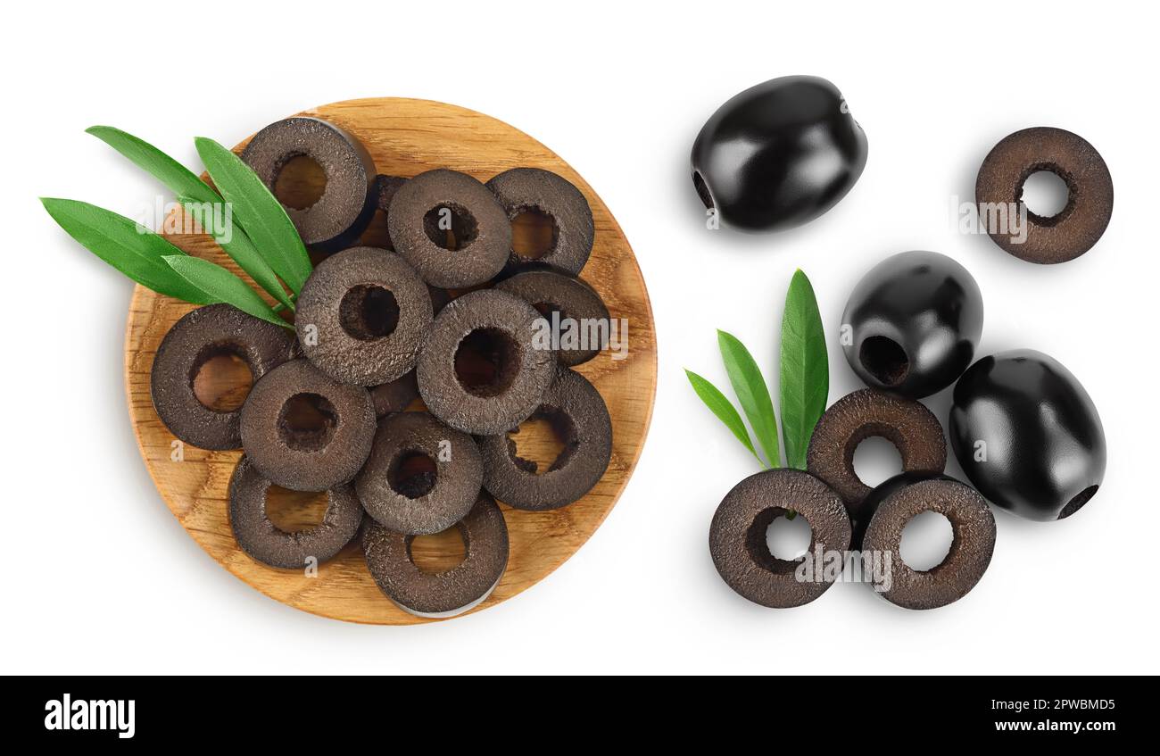 Black olive slices in wooden bowl isolated on a white background with ...