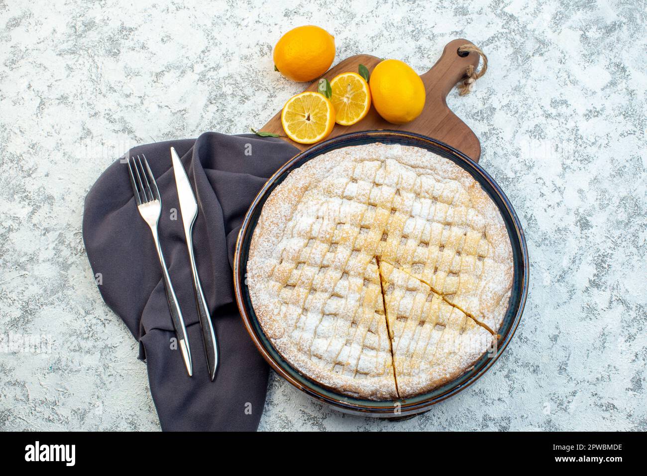 top view yummy lemon pie sugar powdered inside pan on white background ...