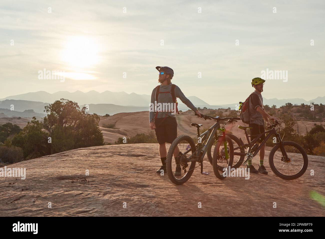 Get your bike and go see the world. Full length shot of two men out ...