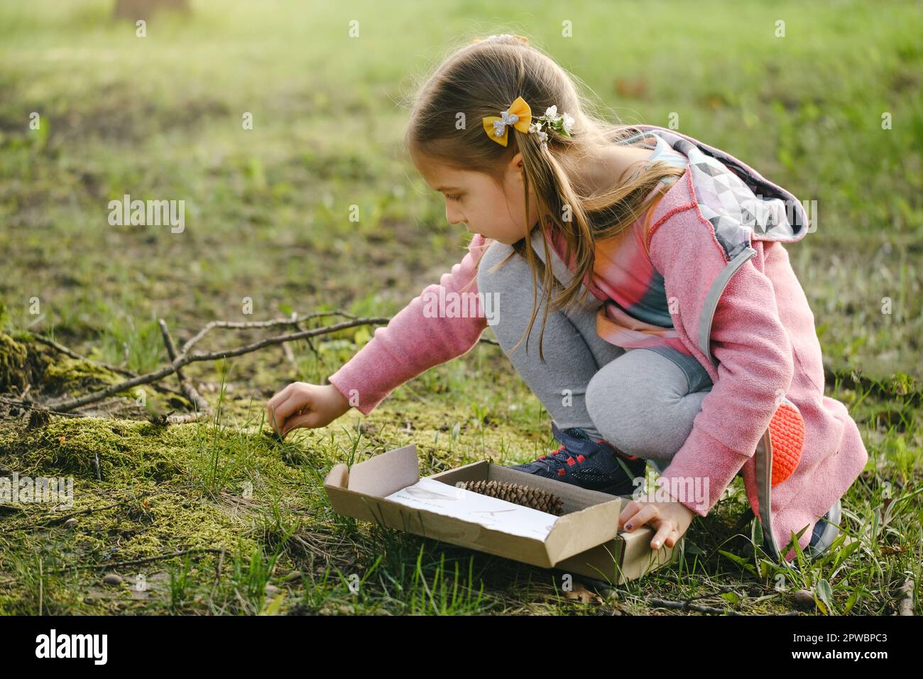 Scavenger hunt for kid in the park. Girl learning about environment ...