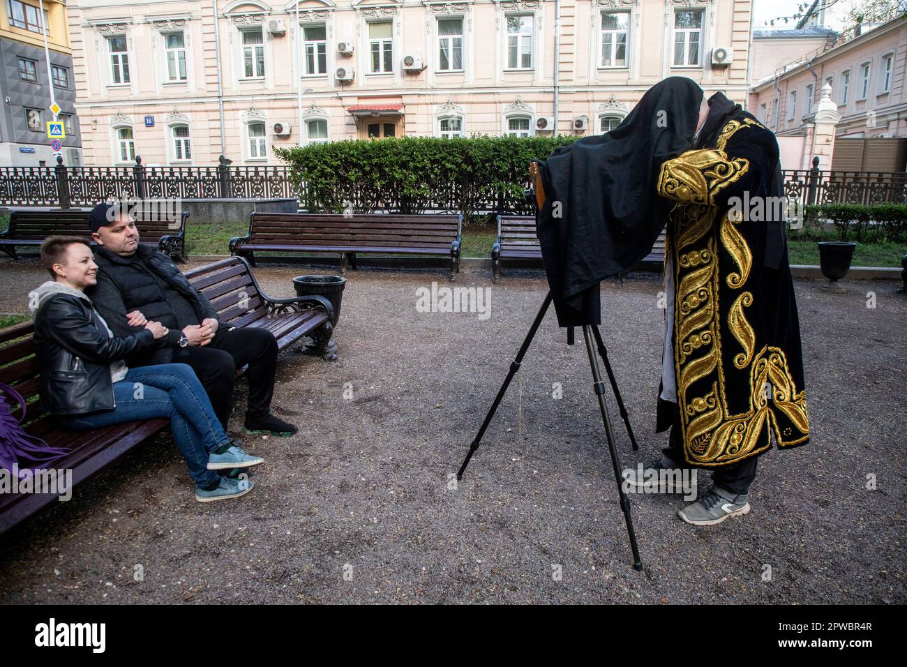 Moscow, Russia. 29th of April, 2023. A photographer shoots a family ...