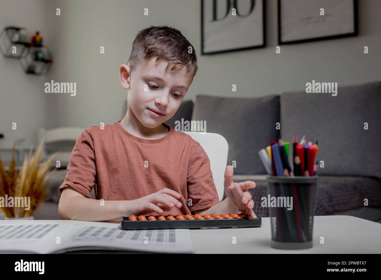 Little boy Counting with help an abacus. Mental arithmetic, brain ...