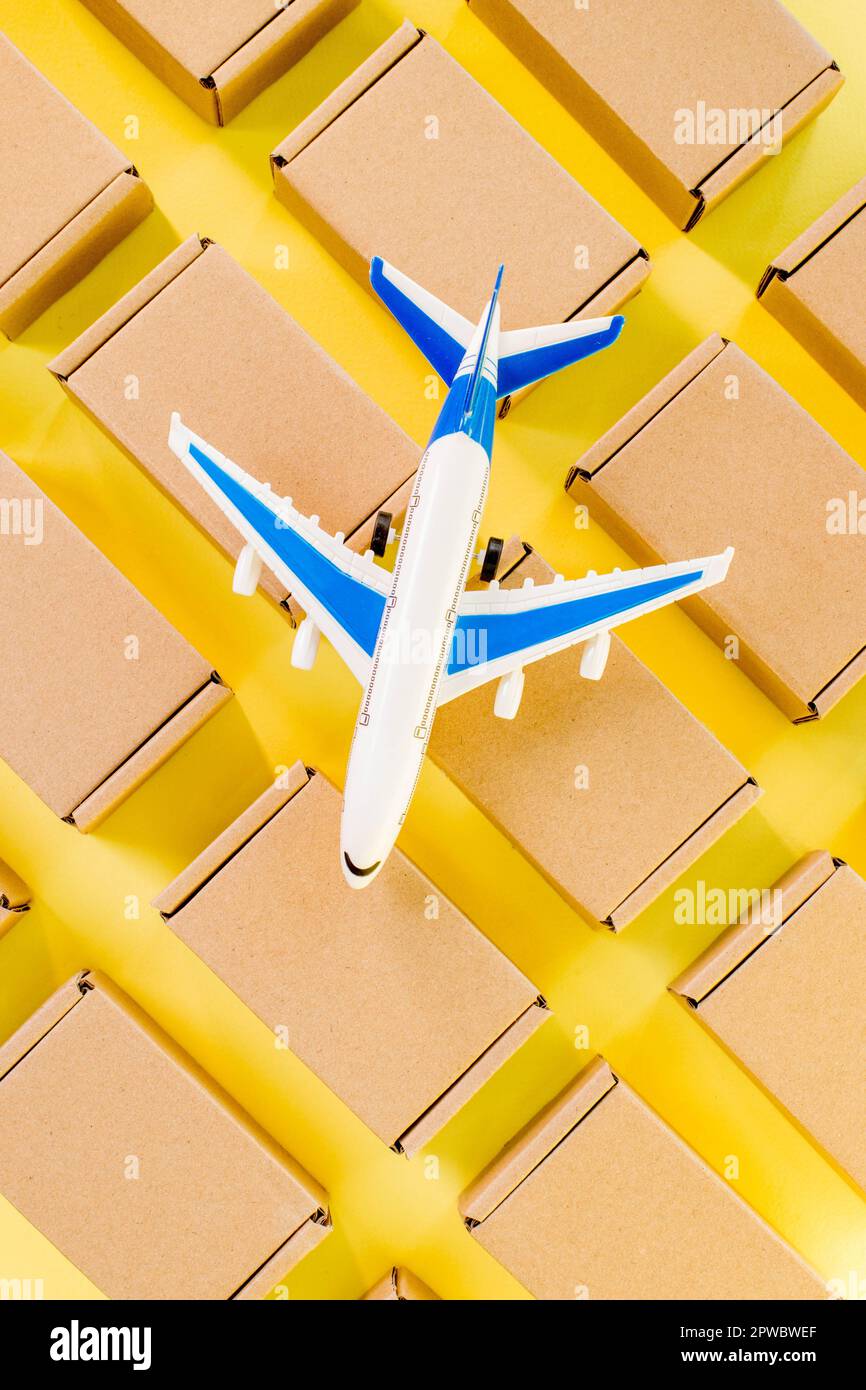Airplane and kraft cardboard boxes. Fast delivery of goods and products ...