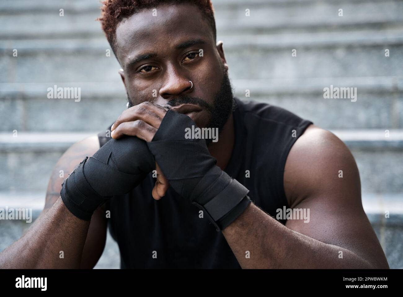 Fit confident sporty young black man boxer fighter sitting outdoors ...