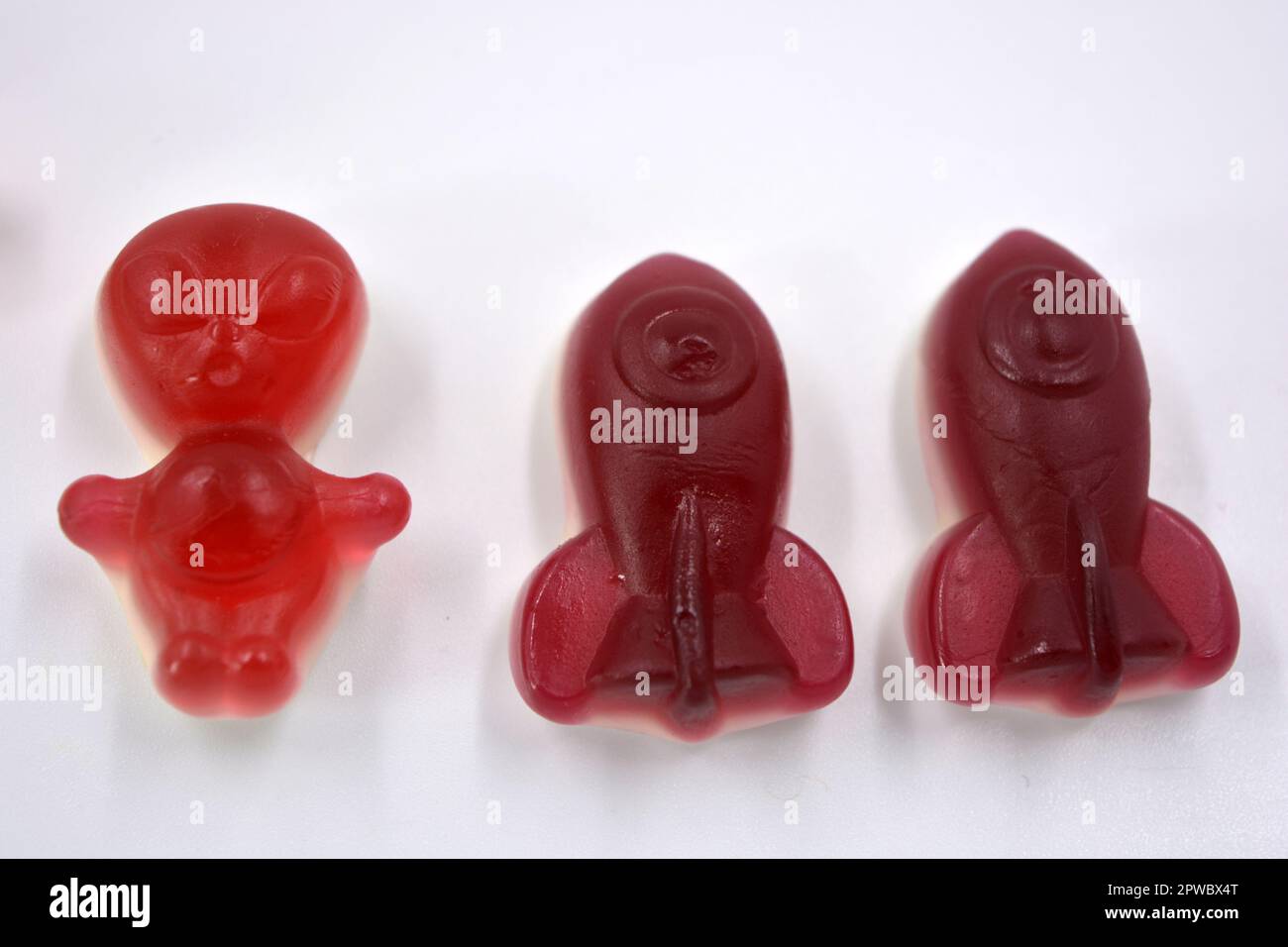 Sweets in the form of red, yellow aliens, cherry space rockets, green ...